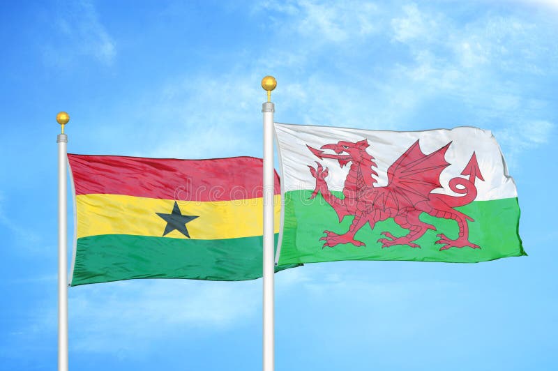 Ghana and Wales Two Flags on Flagpoles and Blue Sky Stock Image - Image ...
