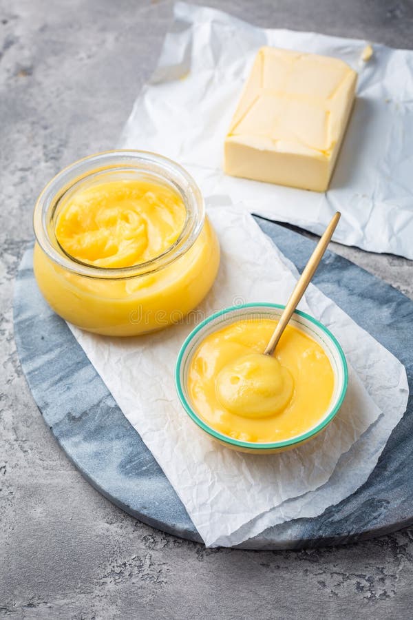 Ghee or Clarified Butter in Jar and Bowl. Indian Butter Stock Image ...