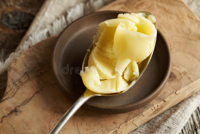 Ghee or Clarified Butter on a Spoon on a Table Stock Image - Image of ...