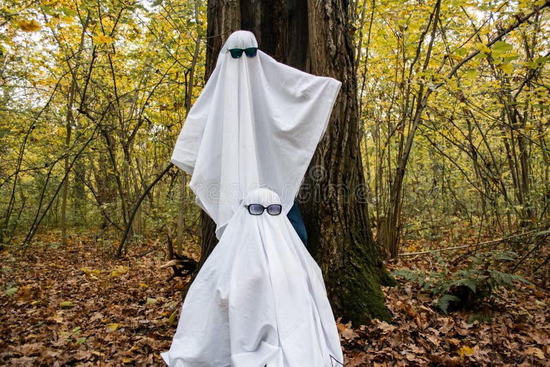 Ghost Challenge in the Forest or Park. Two Unrecognizable People ...