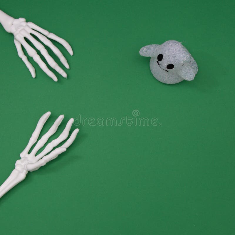 Ghost and Skeleton Hands on a Green Background with Copy Space Stock ...