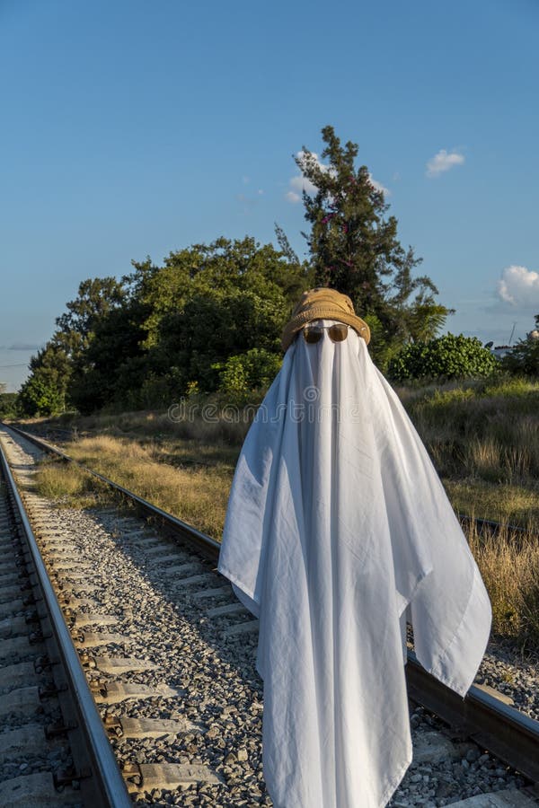 Ghost on Train Tracks with Train Passing Behind, at Sunset, Mexico ...