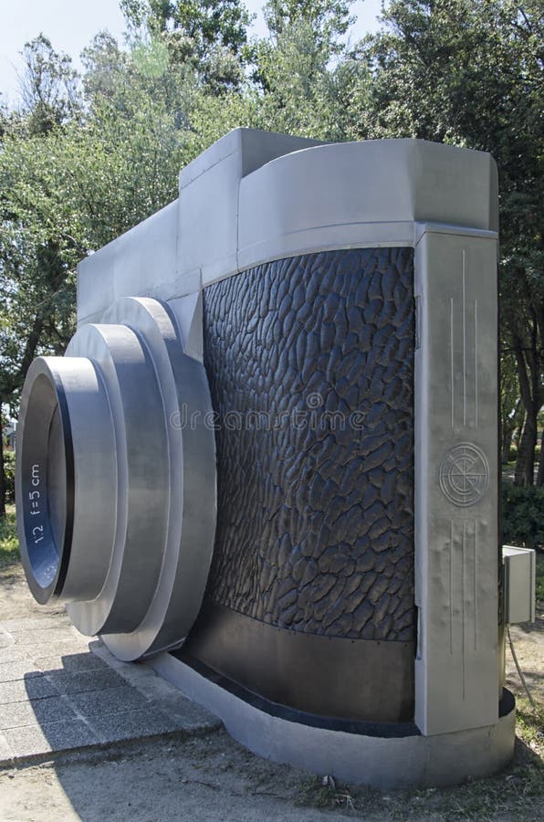 Giant Camera Checkes Group of People As a Metaphor of AI-driven ...