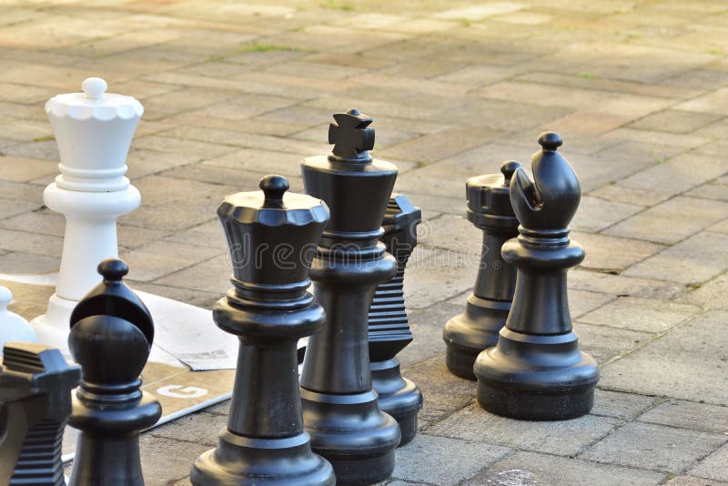 Giant Chess Pieces in the Open Air. Duel. Game Stock Photo - Image of ...