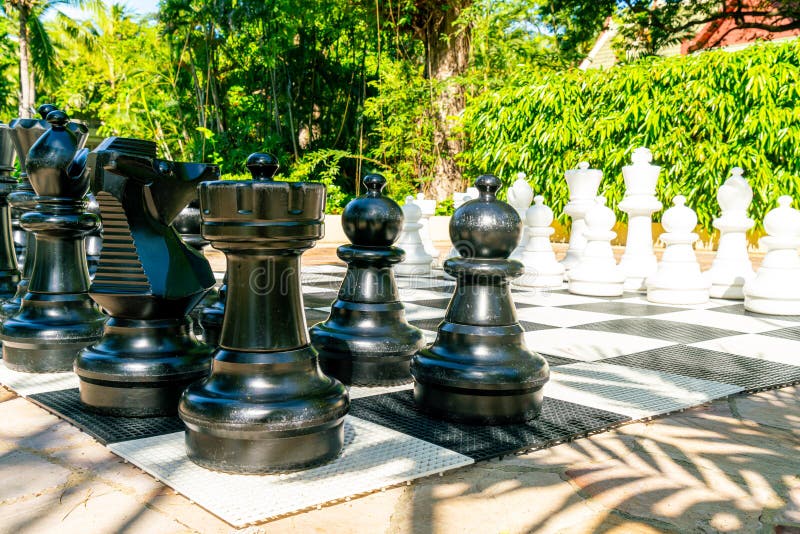 Giant chess on playground stock photo. Image of black - 214545378