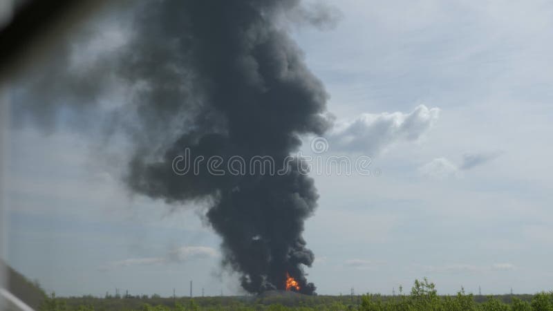 A Giant Fire and a Column of Black Smoke after the Explosion at the Oil ...