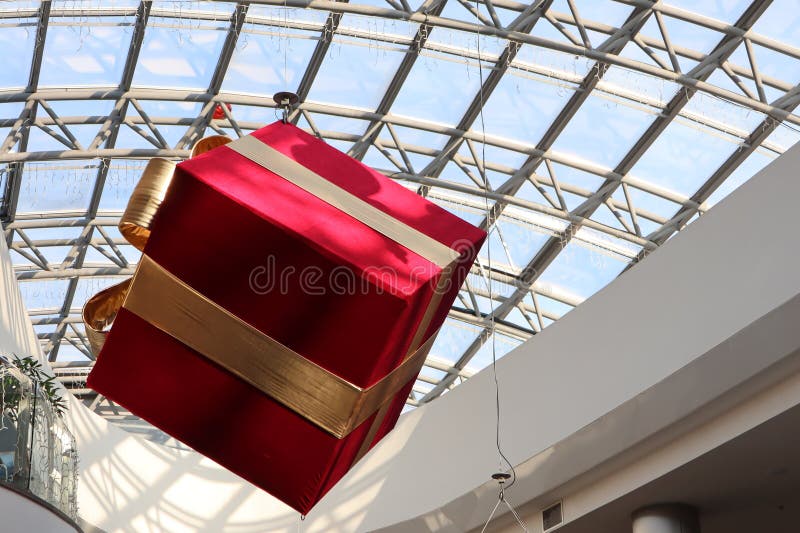 A Giant Floating Gift Box Display Positioned in the Modern Atrium of ...