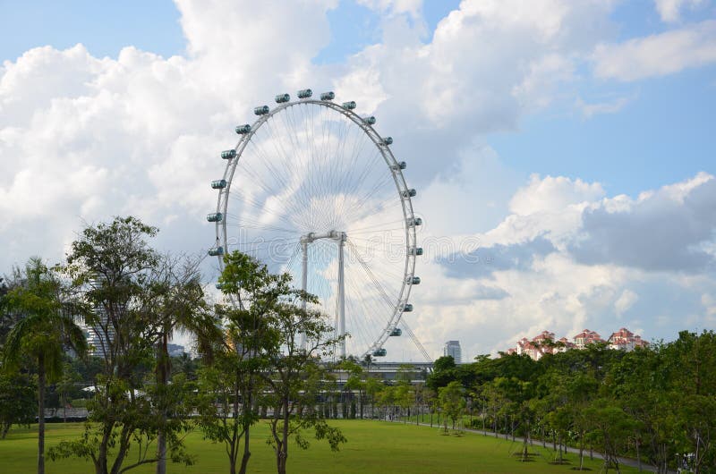 Giant Flywheel Infront of Beautiful Garden Stock Image - Image of ...