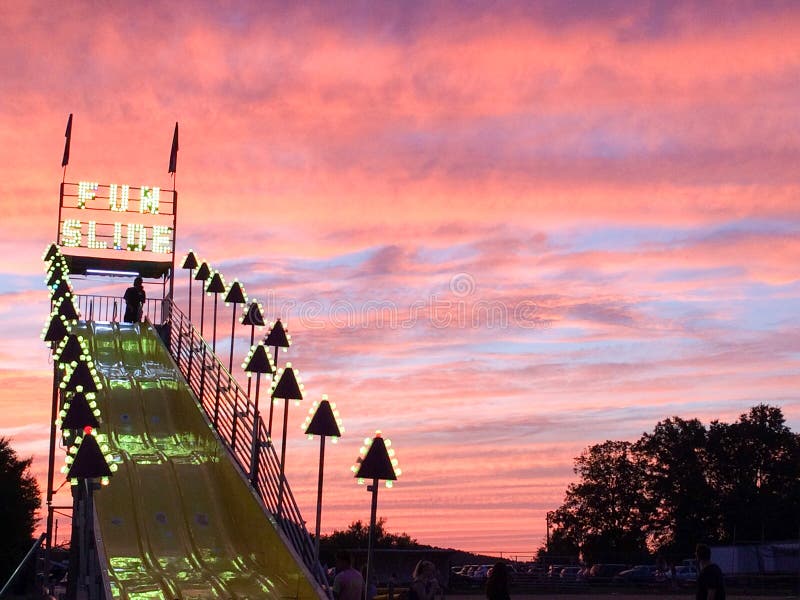 Giant Fun Slide at Fairgrounds at Sunset Editorial Stock Photo - Image ...