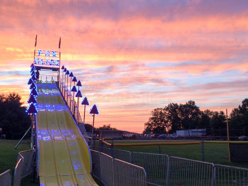 Giant Fun Slide at Fairgrounds at Sunset Stock Image - Image of ...