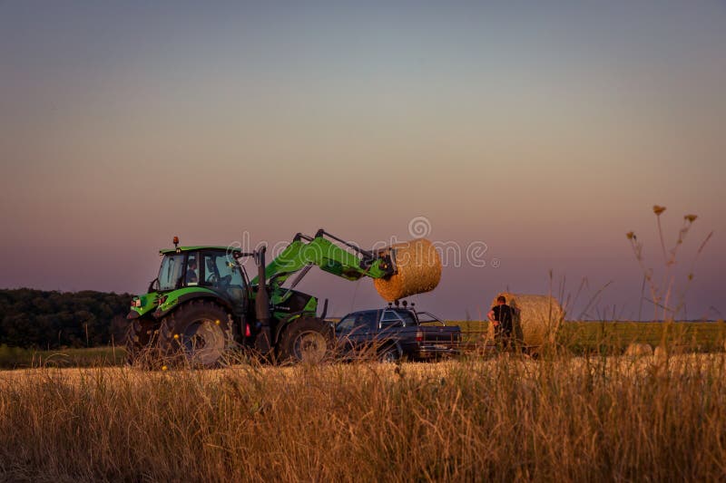 Hay Rolls at the Field Loading Up Editorial Photography - Image of ...