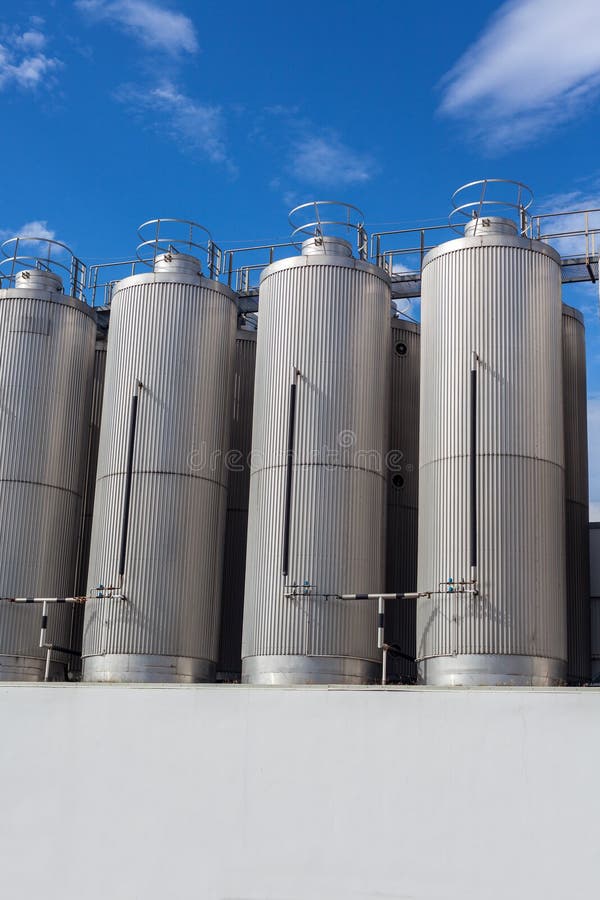 Giant Industrial Tanks on the Bright Blue Sky Stock Image - Image of ...