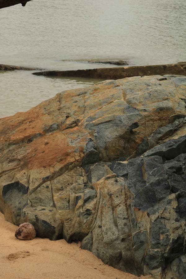 Giant rock on the beach stock image. Image of terrain - 258216655