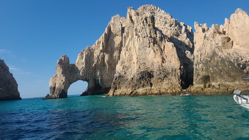 Giant Rock Formation in the Crystal Blue Waters of the Ocean Stock ...