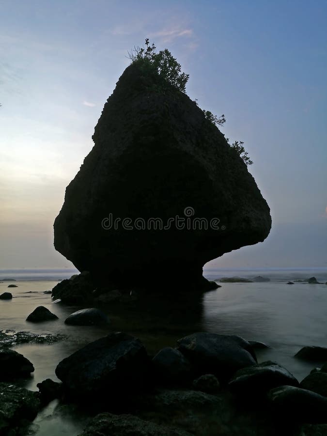 Giant Rock on the Seashore in East Java, Indonesia Stock Photo - Image ...