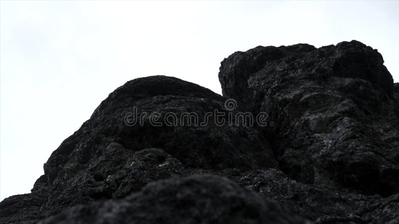 Giant Rocks on Cloudy Sky Background. Clip. Close Up of Grey Stone ...