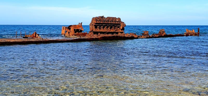 The Giant Ship and the Rusty Engine on the Water Jetty Stock Image ...
