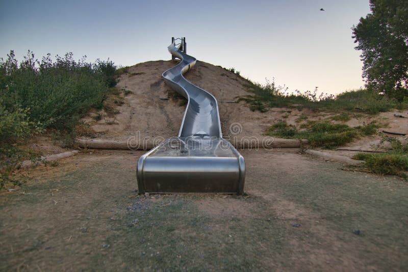 Giant Slide with Blue Sky and Some Kids Playing Editorial Stock Image ...