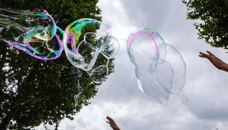 Giant Soap Bubbles Explode at the Touch of Children S Hands Stock Photo ...