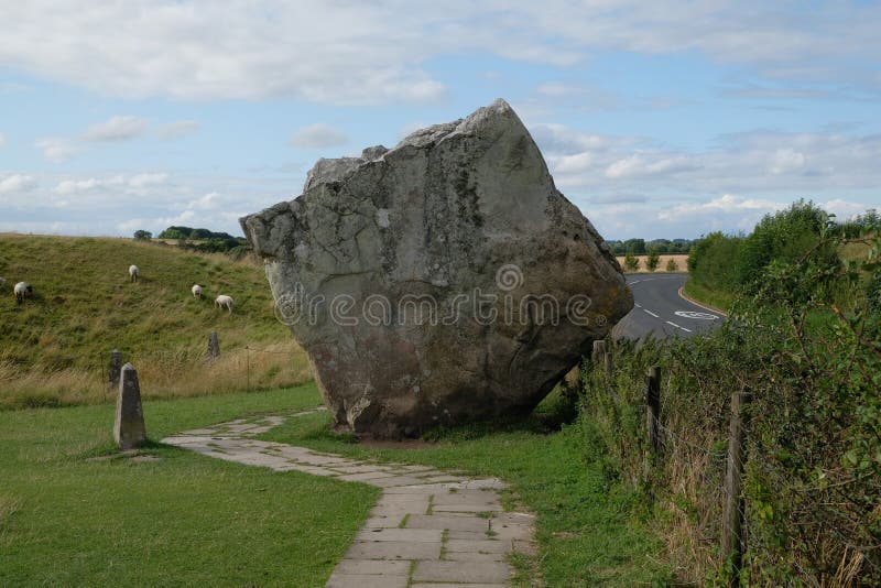Giant Square Rock in a Meadow with Sheep Stock Image - Image of natural ...