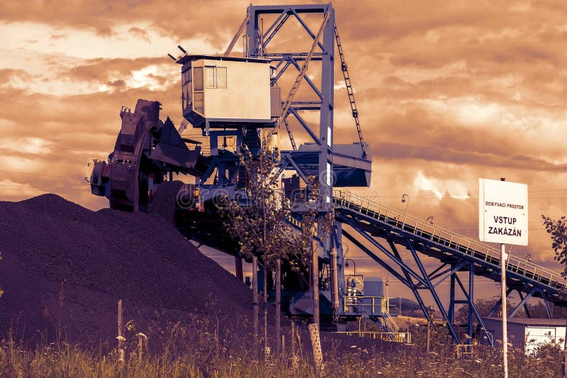 A Giant Wheel Excavator in Brown Coal Mine in the Sunset Stock Image ...