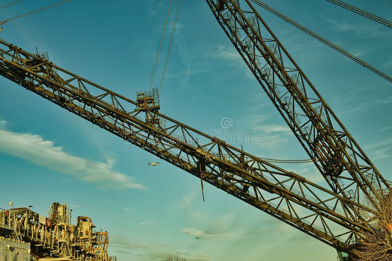 Giants of Mining Crane Boom Under a Blue Sky Stock Photo - Image of ...
