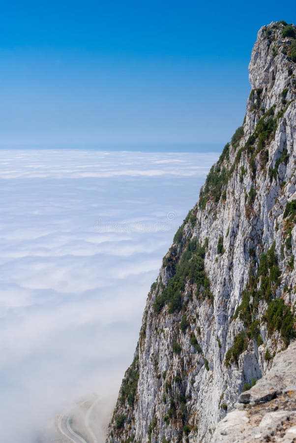 Gibraltar Cliff Face Above Clouds on Sky. Stock Photo - Image of ...