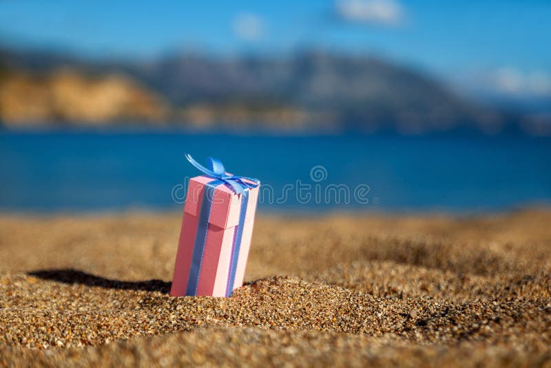 Gift box on a beach stock image. Image of shore, holiday - 79649923