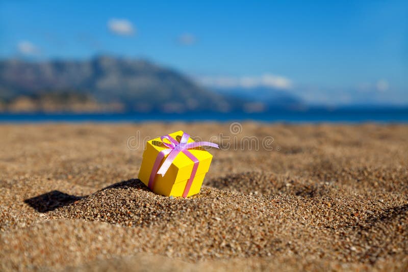 Gift box on a beach stock image. Image of beach, outdoor - 79269339