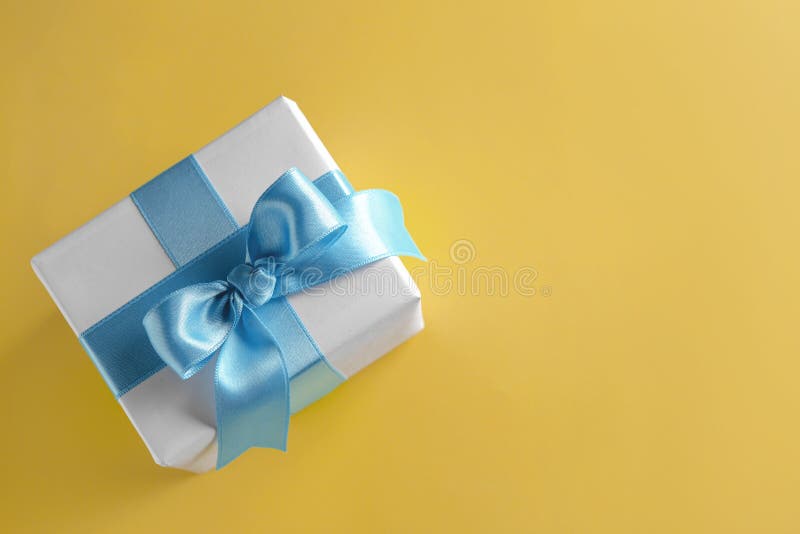 Gift Box with Blue Ribbon on Color Background Stock Photo - Image of ...