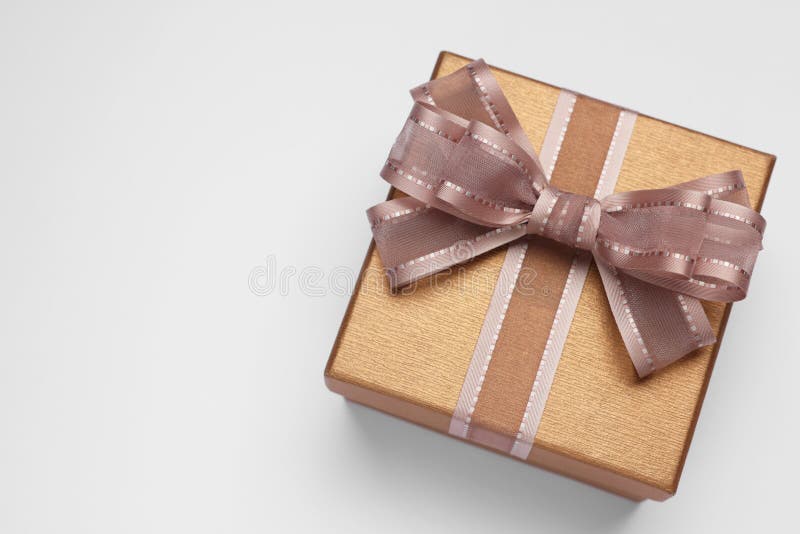 Gift Box with Bow on Light Grey Background, Top View. Space for Text ...