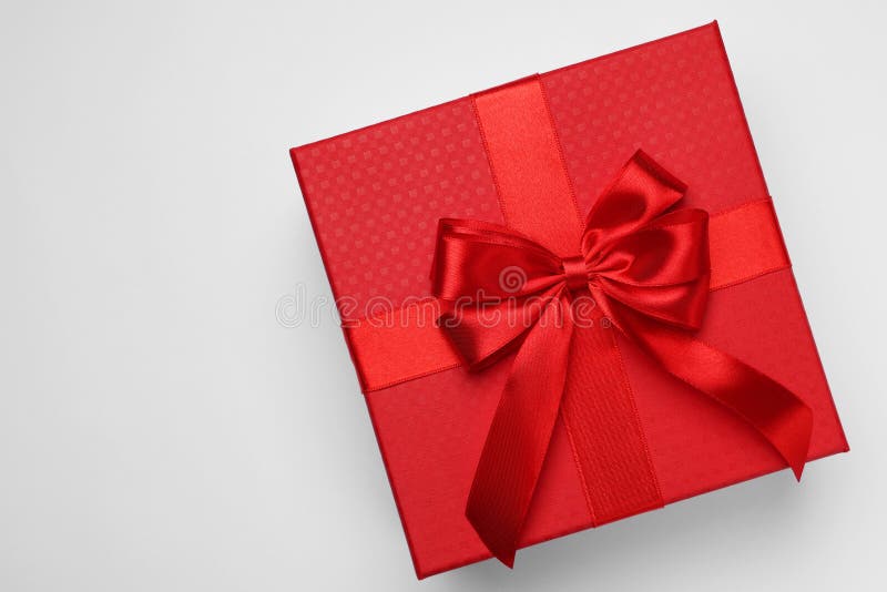 Gift Box with Bow on Light Grey Background, Top View. Space for Text ...