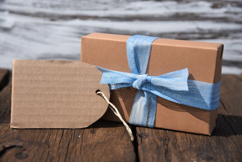 Gift Box with Bow on Wood Table Front View Stock Photo - Image of happy ...