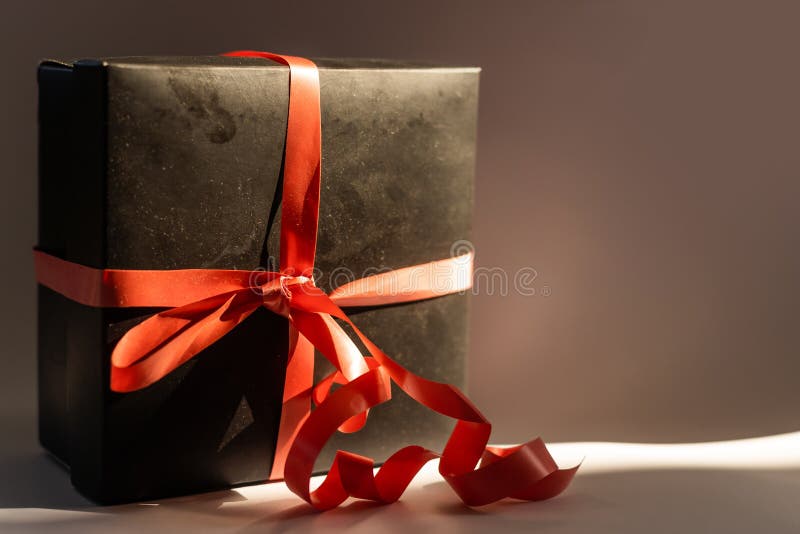 Gift Box with Bright Bow on Black Background Stock Photo - Image of ...