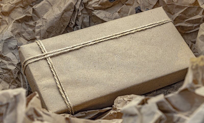 Gift Box on Brown Crumpled Paper Close Up Stock Photo - Image of parcel ...