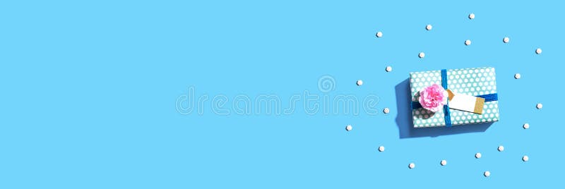 Gift Box with Carnation Flower Overhead View Stock Photo - Image of ...