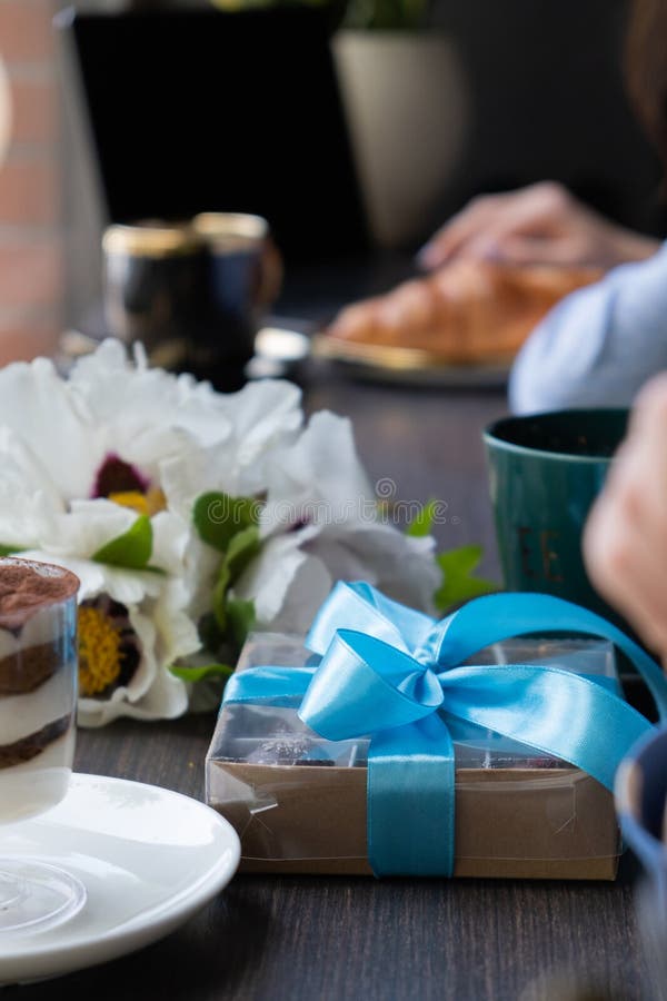 Gift Box with Chocolate Craft Candies in Cafe Interior. Sweet Gift Box ...