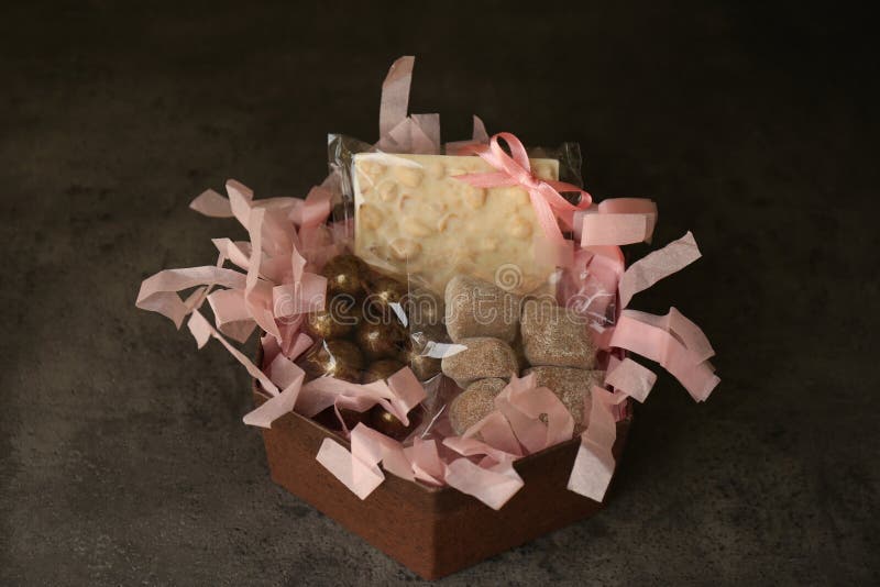 Gift Box with Chocolate and Sweets on Dark Table Stock Image - Image of ...