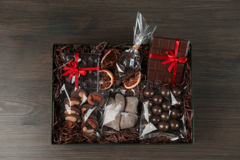 Gift Box with Chocolate and Sweets on Wooden Table, Top View Stock ...