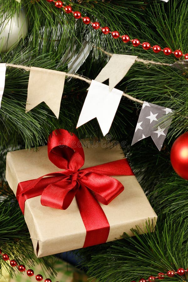 Gift box on Christmas tree stock image. Image of rope - 63050561