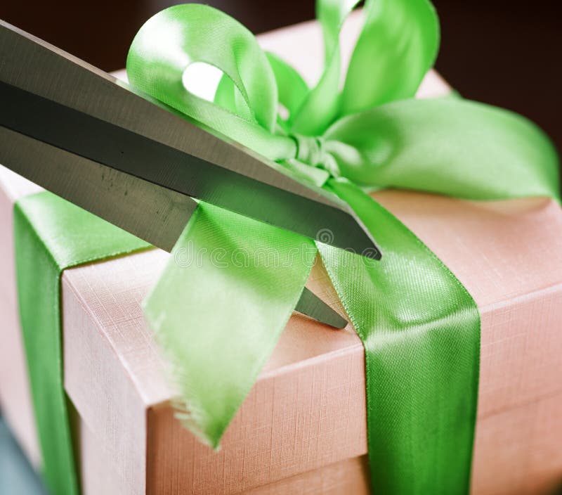 Decorating Gift Box with Green Ribbon Using Scissor Stock Photo - Image ...