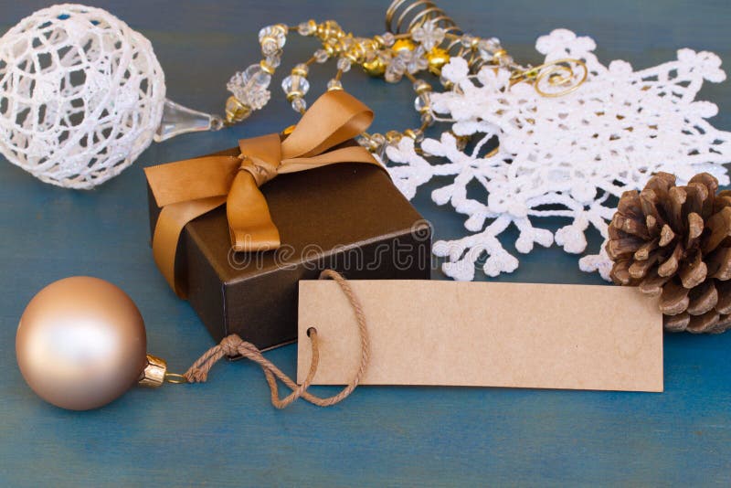 Gift Box with Decorations and Empty Tag Stock Photo - Image of bulb ...