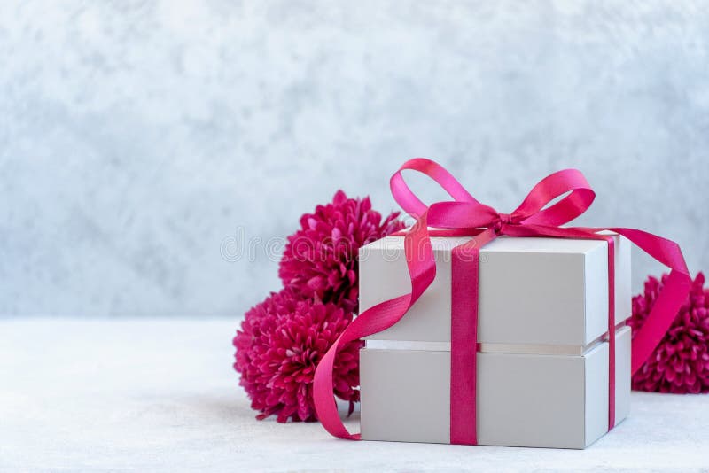 Gift Box with White Daisy Flowers on Yellow Background. Top View with ...