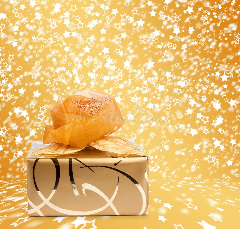 Gift Box in Gold Wrapping Paper Stock Photo - Image of garland, scroll ...