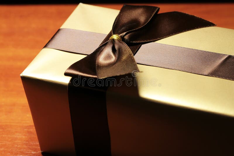Gift box of golden color stock photo. Image of father - 77163292