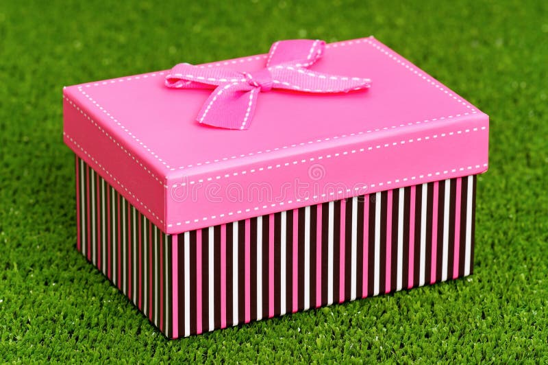 Gift box on grass stock image. Image of artificial, idea - 27795789