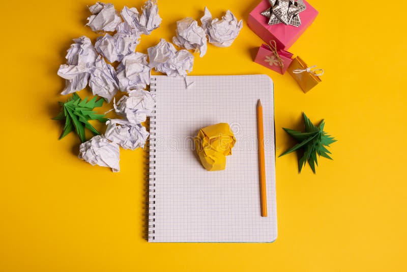 Gift Box and Green Origami Trees with Notepad on Yellow Desk, Table ...