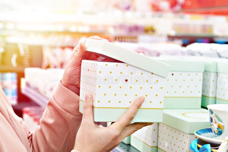 Gift box in hands of store stock image. Image of female - 174775215