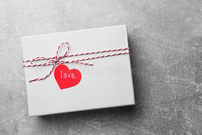 Gift Box and Heart Shaped Sticker with Word LOVE on Grey Background ...