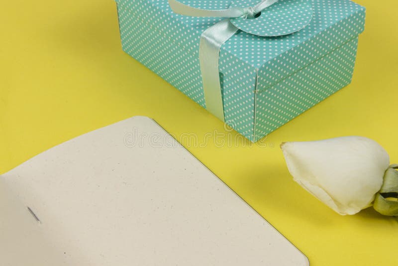 Gift Box Next To Notepad and a Flower Stock Photo - Image of flower ...